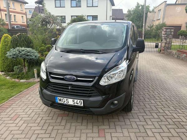 Black Ford Tourneo Custom 2014 in Plunge, with an engine capacity of 2.20 L and mileage of 199 thousand km for 11500 €, photo 5 on AUTOMOTO.COM.LV