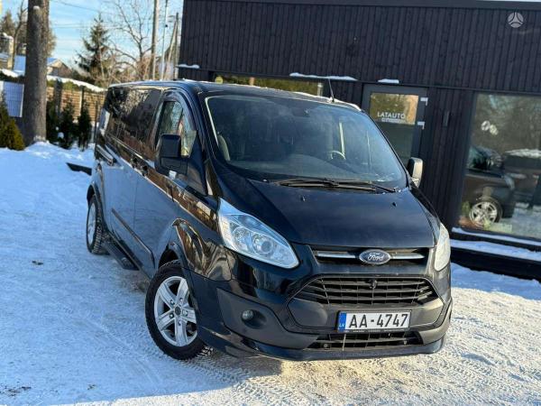 Black Ford Tourneo Custom 2015 in Riga, with an engine capacity of 2.20 L and mileage of 339 thousand km for 10999 €, photo 2 on AUTOMOTO.COM.LV