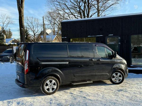 Black Ford Tourneo Custom 2015 in Riga, with an engine capacity of 2.20 L and mileage of 339 thousand km for 10999 €, photo 4 on AUTOMOTO.COM.LV