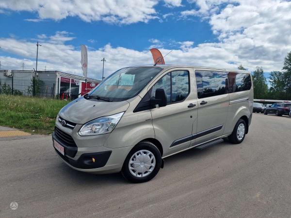 Grey Ford Tourneo Custom 2015 in Kaunas, with an engine capacity of 2.20 L and mileage of 290 thousand km for 11790 €, photo 3 on AUTOMOTO.COM.LV