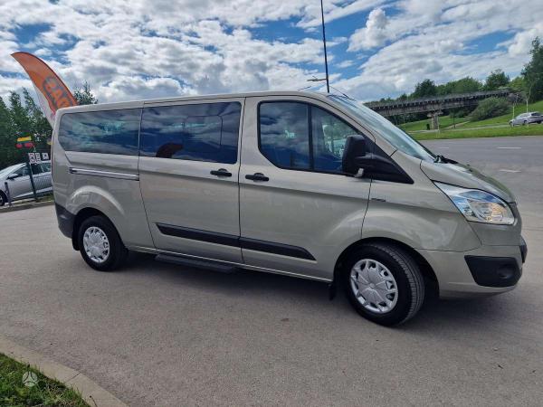 Grey Ford Tourneo Custom 2015 in Kaunas, with an engine capacity of 2.20 L and mileage of 290 thousand km for 11790 €, photo 4 on AUTOMOTO.COM.LV