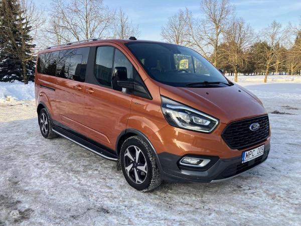 Orange Ford Tourneo Custom 2022 in Rokiskis, with an engine capacity of 2.00 L and mileage of 125 thousand km for 35500 €, photo 1 on AUTOMOTO.COM.LV