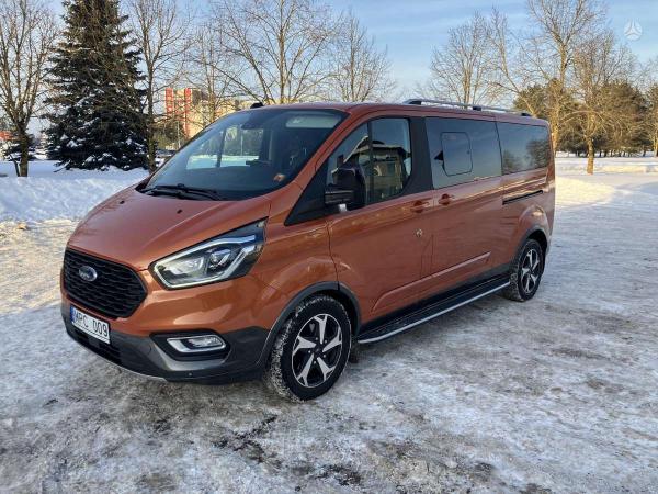 Orange Ford Tourneo Custom 2022 in Rokiskis, with an engine capacity of 2.00 L and mileage of 125 thousand km for 35500 €, photo 2 on AUTOMOTO.COM.LV