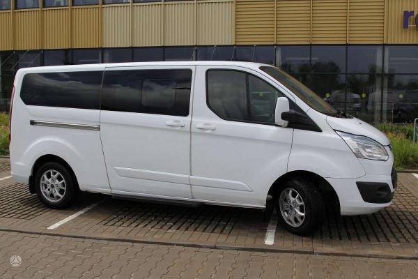 White Ford Tourneo Custom 2014 in Vilnius, with an engine capacity of 2.20 L and mileage of 252 thousand km for 11990 €, photo 3 on AUTOMOTO.COM.LV