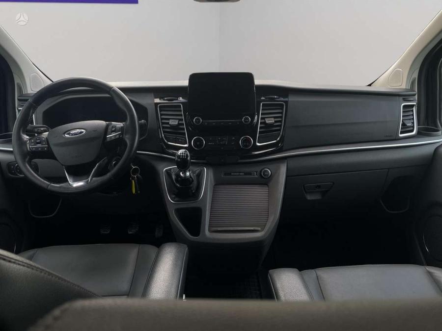 White Ford Tourneo Custom 2019 in Vilnius, with an engine capacity of 2.00 L and mileage of 243 thousand km for 21999 €, photo 12 on AUTOMOTO.COM.LV