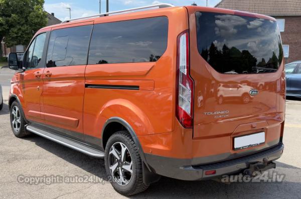 Orange Ford Tourneo 2022 in Tartu, with an engine capacity of 2.00 L and mileage of 96 thousand km for 32790 €, photo 2 on AUTOMOTO.COM.LV
