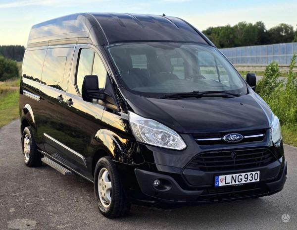 Black Ford Transit Custom 2014 in Siauliai, with an engine capacity of 2.20 L and mileage of 330 thousand km for 7850 €, photo 2 on AUTOMOTO.COM.LV