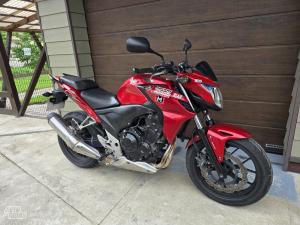 Red Honda CB 500F 2014 in Pasvalys, with an engine capacity of 0.50 L and mileage of 60 thousand km for 1749 €, photo 18 on AUTOMOTO.COM.LV