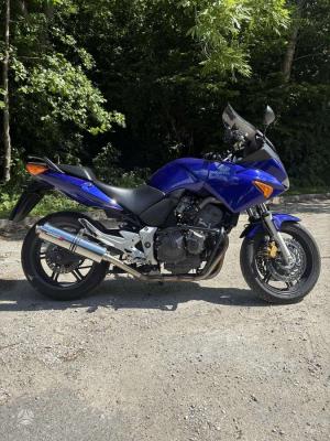 Honda CBF 2004 Šakiai, ar dzinēja tilpumu 0.60 L un nobraukumu 49 tūkst. km par 2500 €, foto  vietnē AUTOMOTO.COM.LV