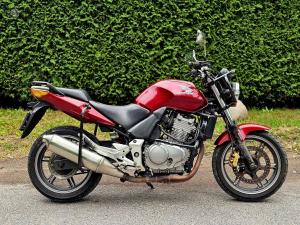 Red Honda CBF 2006 in Vilnius, with an engine capacity of 0.50 L and mileage of 65 thousand km for 1250 €, photo 3 on AUTOMOTO.COM.LV