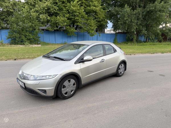 Brown Honda Civic 2007 in Vilnius, with an engine capacity of 1.80 L and mileage of 236 thousand km for 890 €, photo 4 on AUTOMOTO.COM.LV