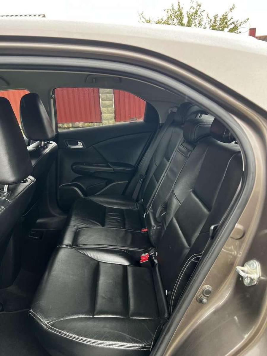 Brown Honda Civic 2013 in Ukmerge, with an engine capacity of 1.60 L and mileage of 228 thousand km for 4250 €, photo 25 on AUTOMOTO.COM.LV