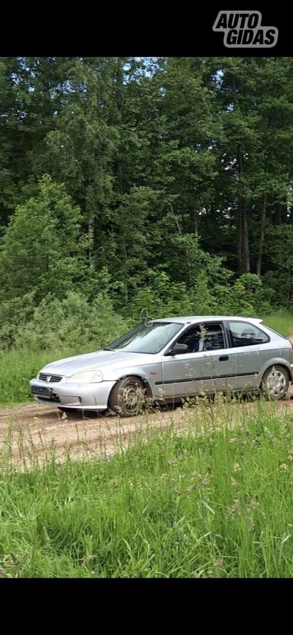Grey Honda Civic 1999 in Vievis, with an engine capacity of 1.40 L and mileage of 252 thousand km for 650 €, photo 1 on AUTOMOTO.COM.LV