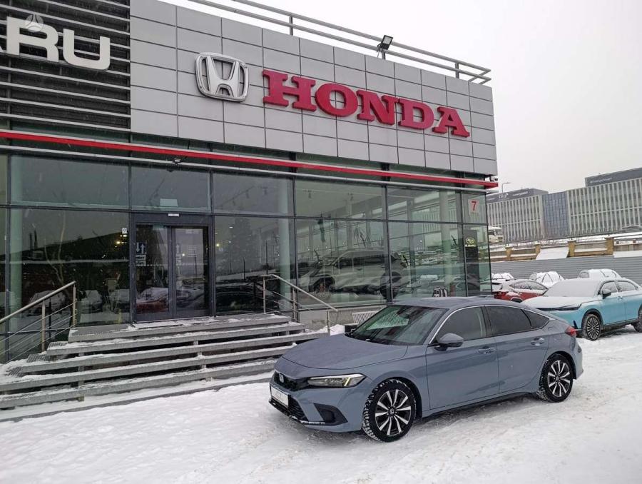 Grey Honda Civic 2023 in Vilnius, with an engine capacity of 1.99 L and mileage of 58 thousand km for 26990 €, photo 2 on AUTOMOTO.COM.LV