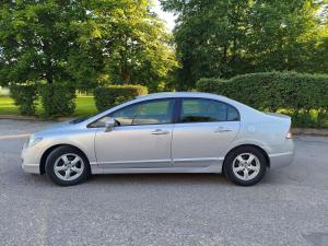 Grey Honda Civic 2009 in Panevezys, with an engine capacity of 1.34 L and mileage of 328 thousand km for 3200 €, photo 15 on AUTOMOTO.COM.LV