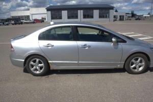 Grey Honda Civic 2009 in Panevezys, with an engine capacity of 1.34 L and mileage of 301 thousand km for 1750 €, photo 6 on AUTOMOTO.COM.LV