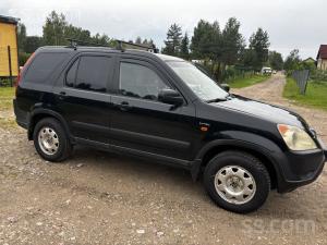 Black Honda CR-V 2003 in Riga, with an engine capacity of 2.00 L and mileage of 302 thousand km for 980 €, photo 6 on AUTOMOTO.COM.LV