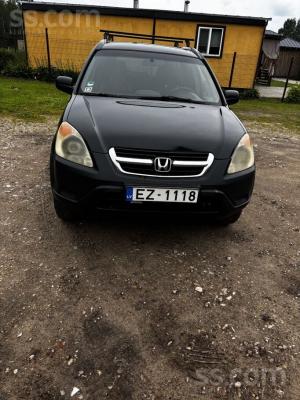 Black Honda CR-V 2003 in Riga, with an engine capacity of 2.00 L and mileage of 302 thousand km for 980 €, photo 7 on AUTOMOTO.COM.LV