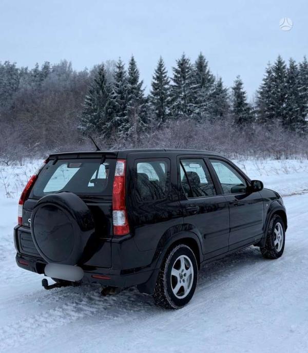 Black Honda CR-V 2005 in Vilnius, with an engine capacity of 2.20 L and mileage of 341 thousand km for 2999 €, photo 5 on AUTOMOTO.COM.LV