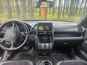 Melns Honda CR-V 2006 Rīga, ar dzinēja tilpumu 2.00 L un nobraukumu 282 tūkst. km par 1250 €, foto 9 vietnē AUTOMOTO.COM.LV