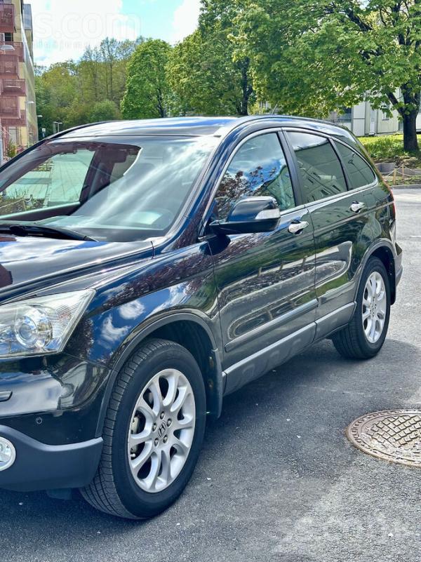 Black Honda CR-V 2009 in Liepaja, with an engine capacity of 2.20 L and mileage of 236 thousand km for 6000 €, photo 9 on AUTOMOTO.COM.LV