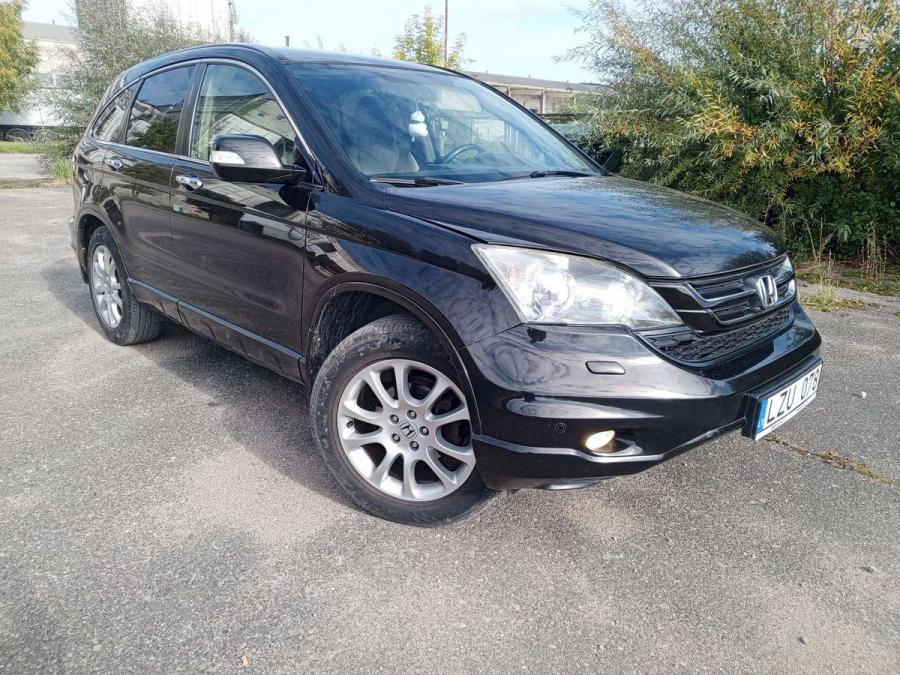 Black Honda CR-V 2011 in Alytus, with an engine capacity of 2.20 L and mileage of 242 thousand km for 7650 €, photo 1 on AUTOMOTO.COM.LV