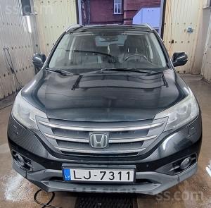 Black Honda CR-V 2013 in Riga, with an engine capacity of 2.20 L and mileage of 222 thousand km for 10700 €, photo 2 on AUTOMOTO.COM.LV