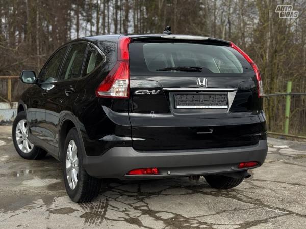 Black Honda CR-V 2013 in Vilnius, with an engine capacity of 2.20 L and mileage of 179 thousand km for 10900 €, photo 2 on AUTOMOTO.COM.LV