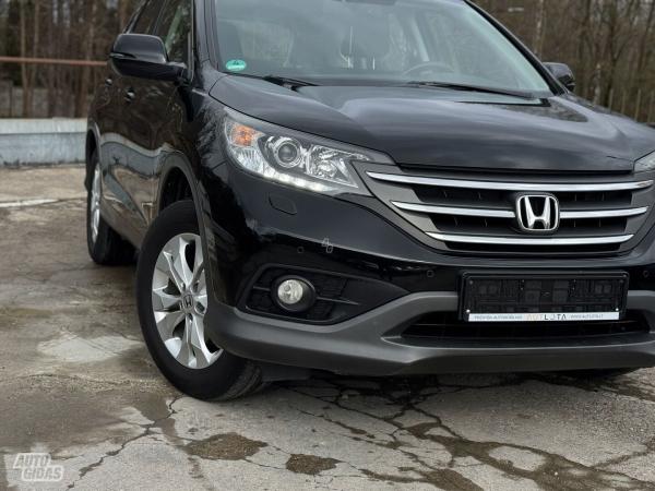 Black Honda CR-V 2013 in Vilnius, with an engine capacity of 2.20 L and mileage of 179 thousand km for 10900 €, photo 10 on AUTOMOTO.COM.LV
