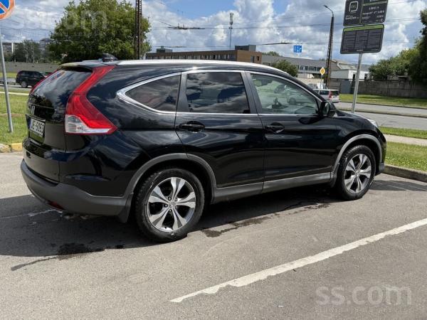 Black Honda CR-V 2013 in Riga, with an engine capacity of 2.20 L and mileage of 225 thousand km for 12000 €, photo 2 on AUTOMOTO.COM.LV