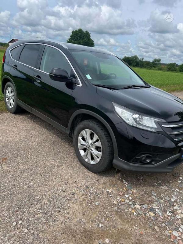 Black Honda CR-V 2013 in Silute, with an engine capacity of 2.20 L and mileage of 240 thousand km for 9500 €, photo 1 on AUTOMOTO.COM.LV