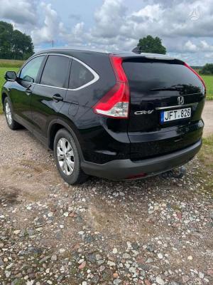 Black Honda CR-V 2013 in Silute, with an engine capacity of 2.20 L and mileage of 240 thousand km for 9500 €, photo 5 on AUTOMOTO.COM.LV