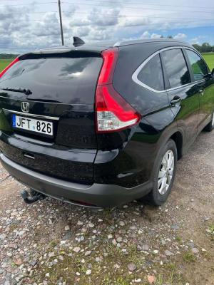Black Honda CR-V 2013 in Silute, with an engine capacity of 2.20 L and mileage of 240 thousand km for 9500 €, photo 6 on AUTOMOTO.COM.LV