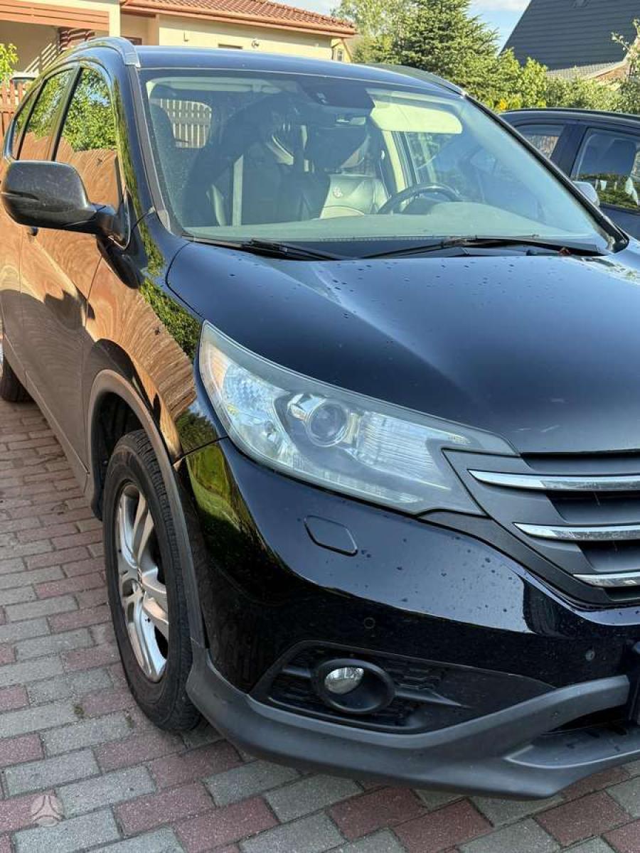 Black Honda CR-V 2013 in Vilnius, with an engine capacity of 2.20 L and mileage of 310 thousand km for 9000 €, photo 1 on AUTOMOTO.COM.LV