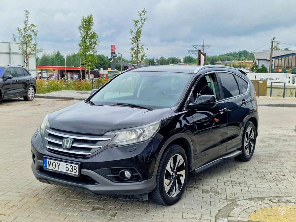 Black Honda CR-V 2014 in Vilnius, with an engine capacity of 2.20 L and mileage of 270 thousand km for 11999 €, photo 5 on AUTOMOTO.COM.LV