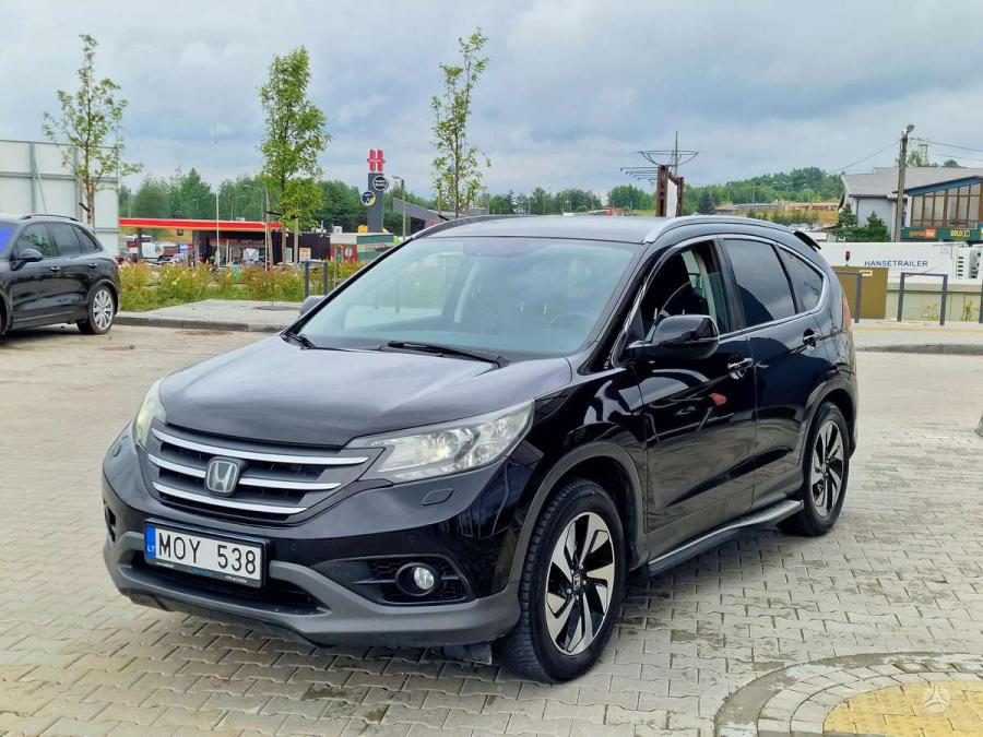 Black Honda CR-V 2014 in Vilnius, with an engine capacity of 2.20 L and mileage of 270 thousand km for 11999 €, photo 6 on AUTOMOTO.COM.LV