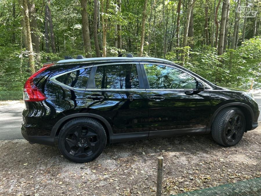 Black Honda CR-V 2016 in Vilnius, with an engine capacity of 1.60 L and mileage of 314 thousand km for 9350 €, photo 19 on AUTOMOTO.COM.LV