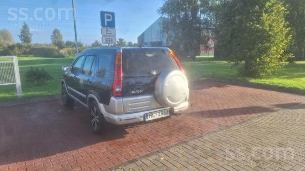 Blue Honda CR-V 2002 in Jelgava, with an engine capacity of 2.00 L and mileage of 214 thousand km for 2100 €, photo 1 on AUTOMOTO.COM.LV