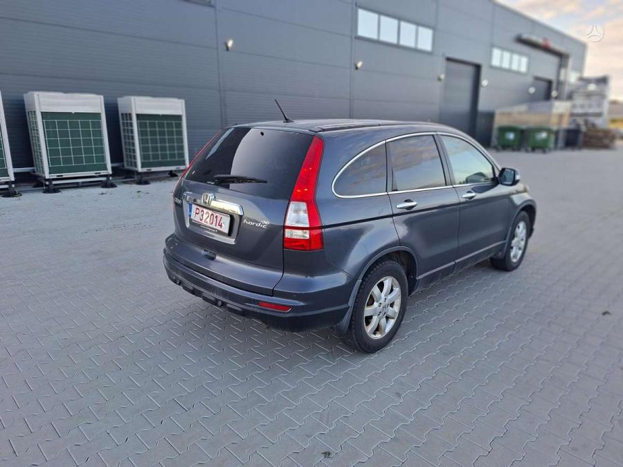 Blue Honda CR-V 2012 in Kaunas, with an engine capacity of 2.20 L and mileage of 290 thousand km for 5600 €, photo 13 on AUTOMOTO.COM.LV