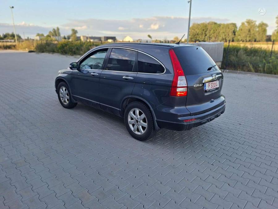 Blue Honda CR-V 2012 in Kaunas, with an engine capacity of 2.20 L and mileage of 290 thousand km for 5600 €, photo 16 on AUTOMOTO.COM.LV