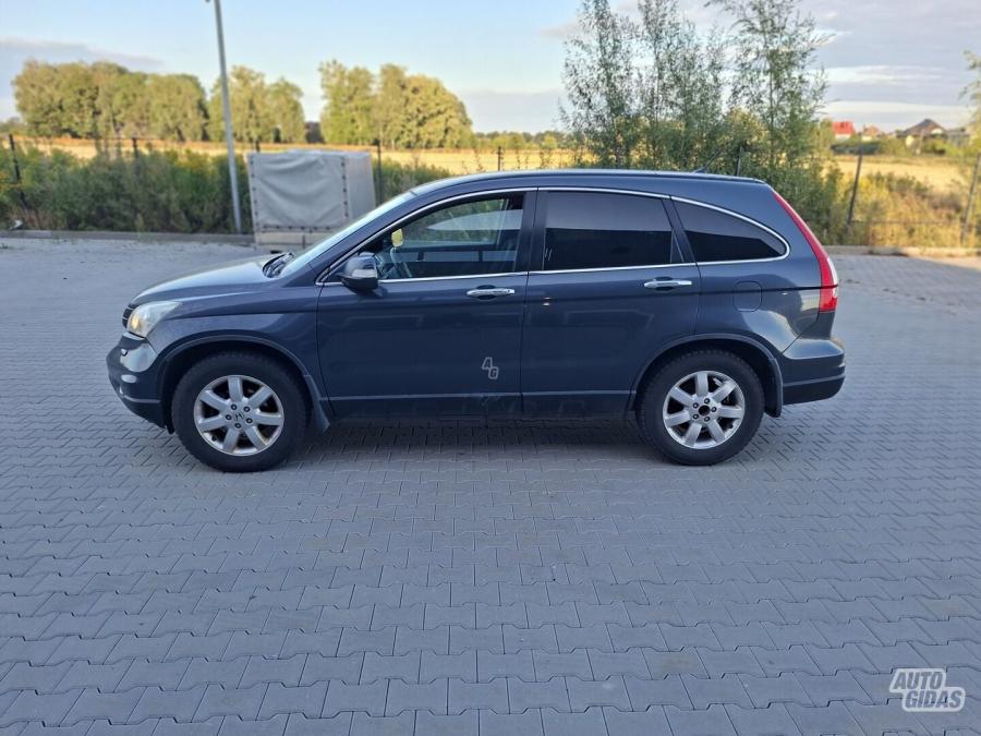 Blue Honda CR-V 2012 in Kaunas, with an engine capacity of 2.20 L and mileage of 290 thousand km for 5350 €, photo 1 on AUTOMOTO.COM.LV