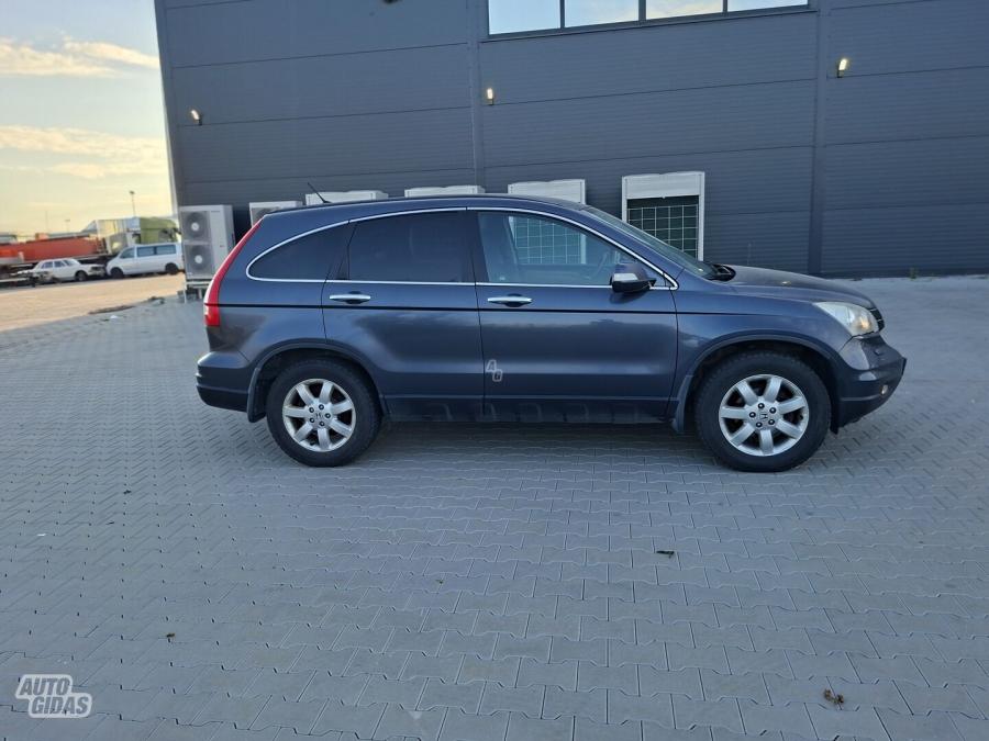 Blue Honda CR-V 2012 in Kaunas, with an engine capacity of 2.20 L and mileage of 290 thousand km for 5350 €, photo 14 on AUTOMOTO.COM.LV