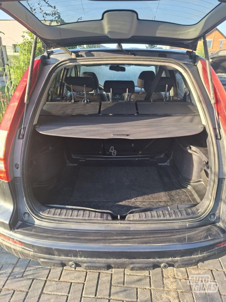 Blue Honda CR-V 2012 in Kaunas, with an engine capacity of 2.20 L and mileage of 290 thousand km for 5350 €, photo 26 on AUTOMOTO.COM.LV