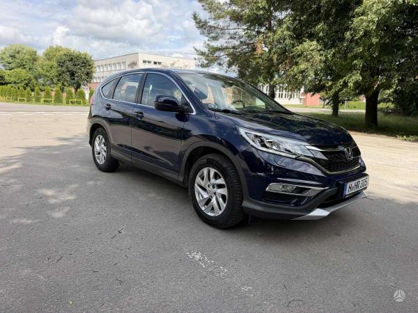 Blue Honda CR-V 2015 in Plunge, with an engine capacity of 1.60 L and mileage of 200 thousand km for 10759 €, photo 2 on AUTOMOTO.COM.LV
