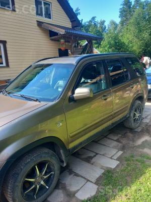 Brown Honda CR-V 2002 in Riga, with an engine capacity of 2.00 L and mileage of 304 thousand km for 1100 €, photo 4 on AUTOMOTO.COM.LV