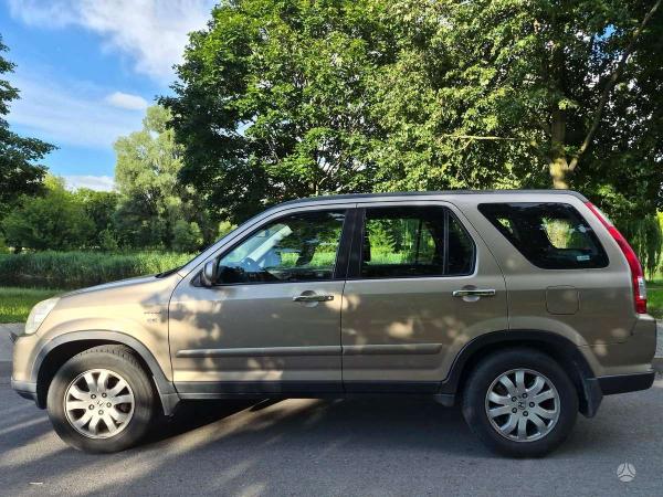 Brown Honda CR-V 2006 in Marijampole, with an engine capacity of 2.00 L and mileage of 230 thousand km for 3490 €, photo 1 on AUTOMOTO.COM.LV