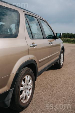 Brown Honda CR-V 2006 in Riga, with an engine capacity of 2.00 L and mileage of 203 thousand km for 4200 €, photo 21 on AUTOMOTO.COM.LV