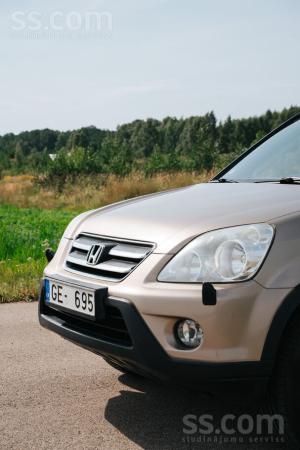 Brown Honda CR-V 2006 in Riga, with an engine capacity of 2.00 L and mileage of 203 thousand km for 4200 €, photo 23 on AUTOMOTO.COM.LV