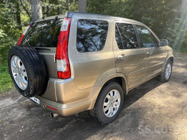 Brown Honda CR-V 2006 in Valmiera, with an engine capacity of 2.00 L and mileage of 340 thousand km for 2350 €, photo 6 on AUTOMOTO.COM.LV