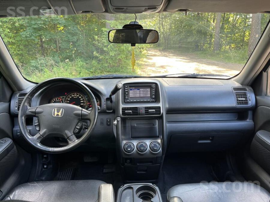 Brown Honda CR-V 2006 in Valmiera, with an engine capacity of 2.00 L and mileage of 340 thousand km for 2350 €, photo 12 on AUTOMOTO.COM.LV